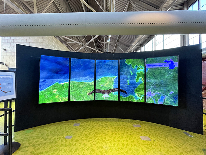 The interactive map display brings Michigan's geography to life, allowing visitors to explore the state's diverse ecosystems with just the touch of a finger.
