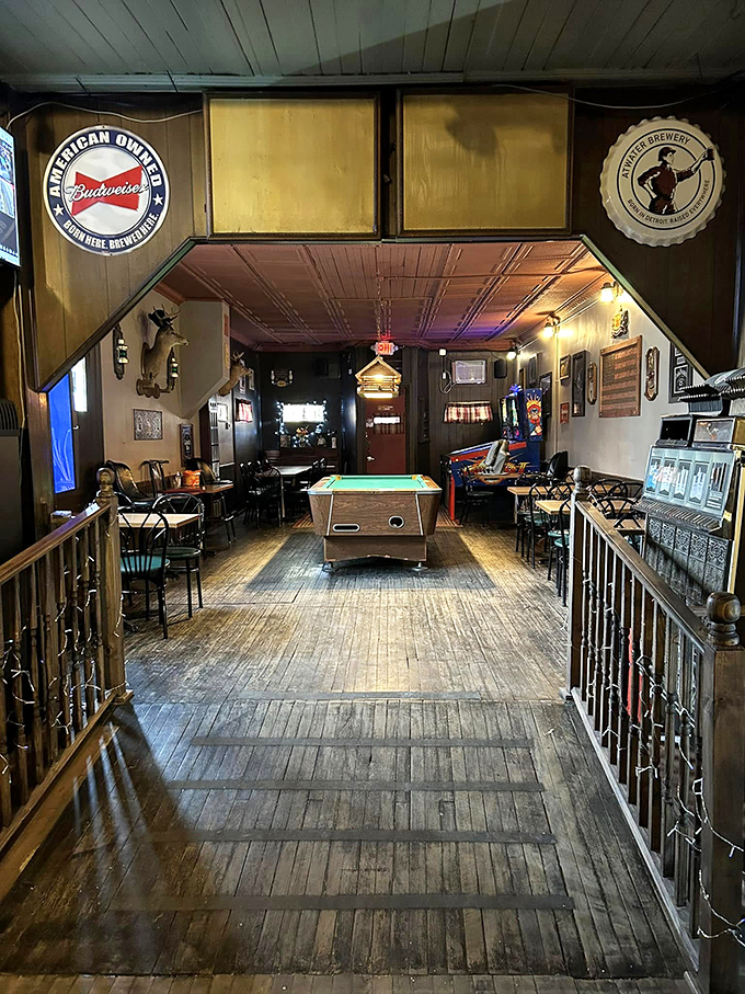 The bar's interior view reveals decades of Detroit history, with memorabilia and photographs documenting the city's colorful past.