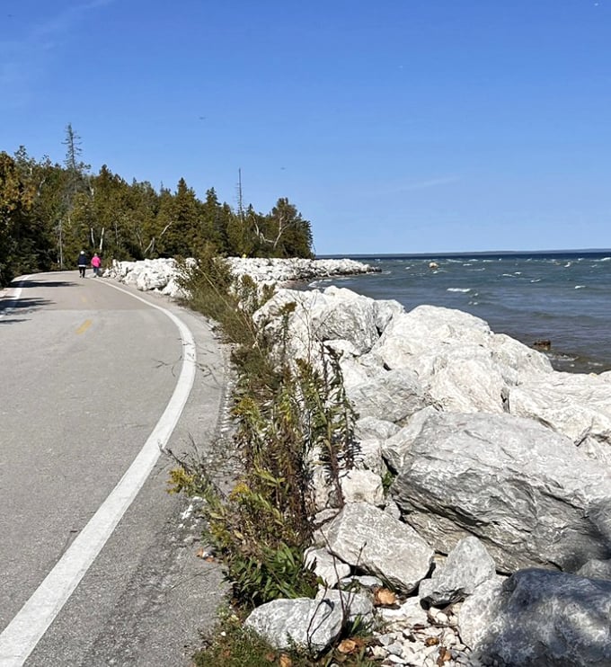 Dappled sunlight creates natural spotlights on the path ahead, inviting exploration around each gentle curve of this car-free paradise.