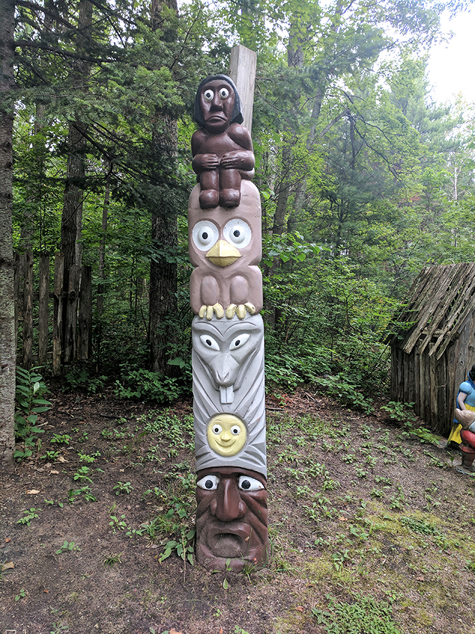 A whimsical woodland totem where surprised eyes and expressive faces stack up to create nature's most unusual apartment building.