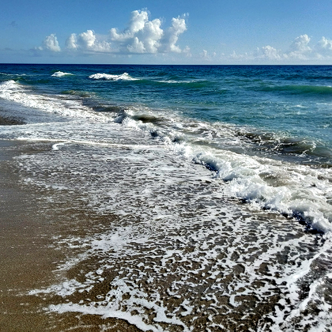 The same powerful Atlantic waves that claimed numerous vessels continue their endless dance with the shoreline beneath the House of Refuge.
