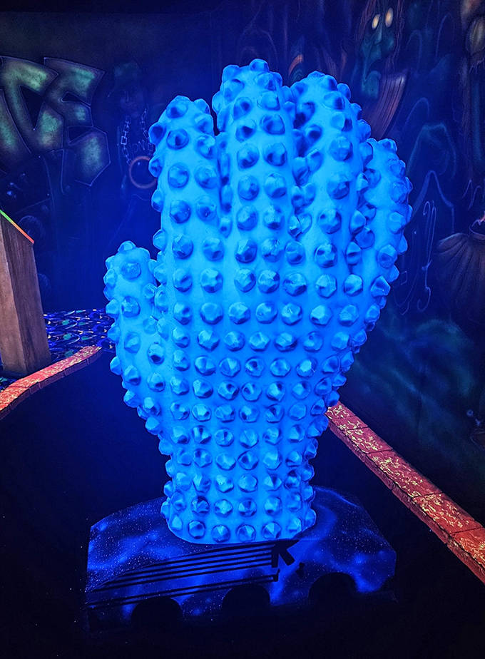 High-five this spiky blue hand and you might just improve your golf score through the power of glowing good vibes.
