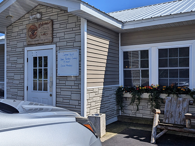 Hoppies Tavern welcomes hungry travelers with its unassuming stone facade, hiding culinary treasures that locals have cherished for years.