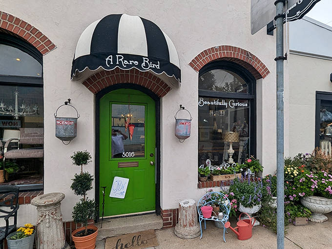 The iconic green door beneath a jaunty black-and-white awning beckons passersby into a world where curiosity is rewarded and time slows down.