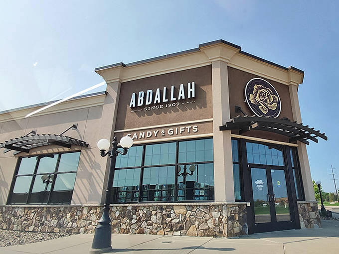 The welcoming facade of Abdallah Candies stands proudly in Apple Valley, promising sweet treasures within its stone-accented walls.