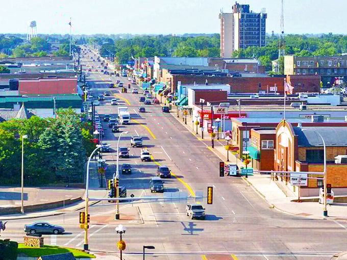 Alexandria's sprawling main thoroughfare stretches into the distance, where brick buildings and leafy trees create that perfect small-town panorama visitors fall in love with.