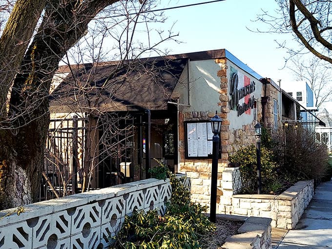 Stone and stucco exterior with vibrant signage beckons cookie pilgrims and pasta lovers to this New Buffalo treasure where Italian tradition meets Midwestern hospitality.