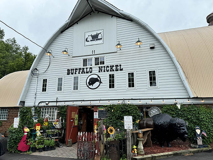 The iconic white barn structure of Buffalo Nickel Antique Mall stands like a beacon for treasure hunters, its curved roof and bold signage promising adventures within.