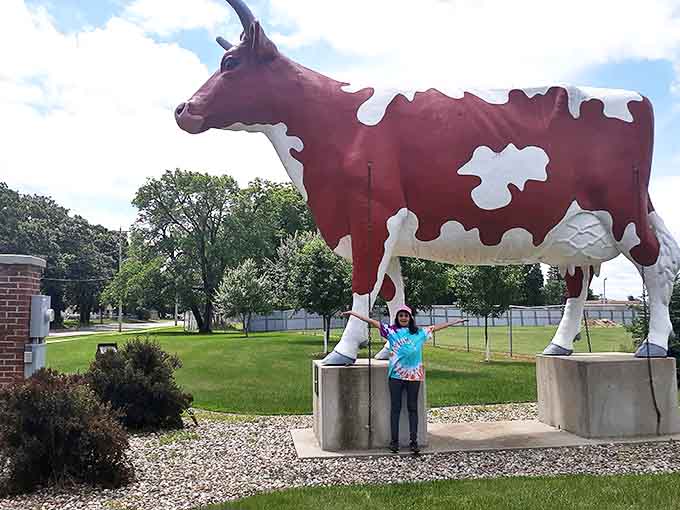 Buffy the Cow stands majestically at the Mower County Fairgrounds, her 15-foot frame casting impressive shadows across the green lawn.