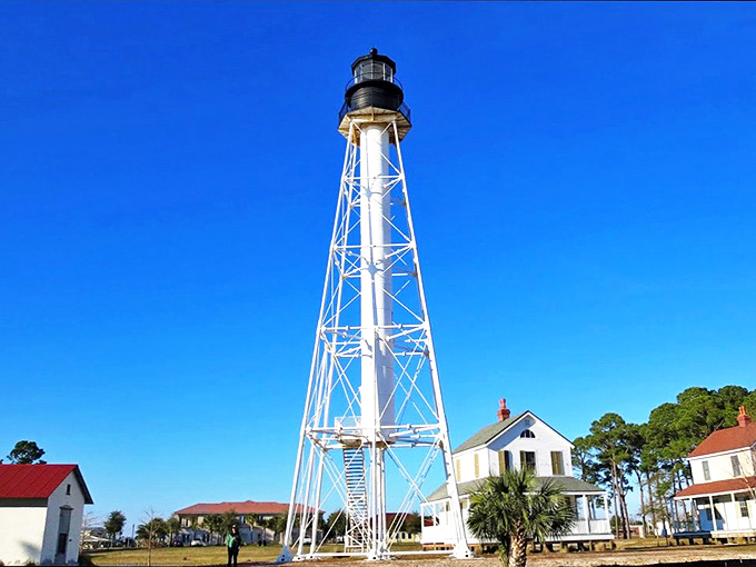 That skeletal frame against the blue sky looks like someone designed a lighthouse after binge-watching engineering documentaries and deciding traditional was overrated.
