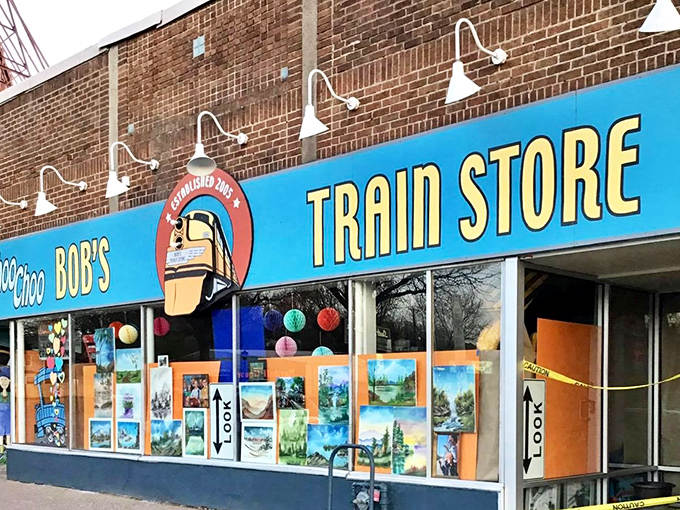 The vibrant blue facade of Choo Choo Bob's Train Store beckons train enthusiasts with its cheerful yellow lettering and colorful window displays, a St. Paul landmark for locomotive lovers.