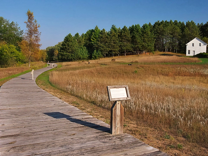 A wooden boardwalk winds through golden prairie grasses, nature's time machine to Minnesota's frontier past.
