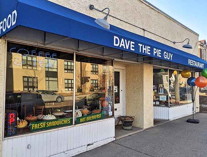 The blue awning of Dave the Pie Guy beckons from the street like a delicious mirage in the Minneapolis landscape.