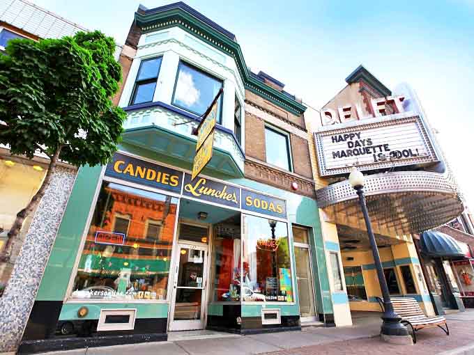 That storefront looks like it time-traveled from 1896 and decided modern architecture could use some lessons in charm and character.