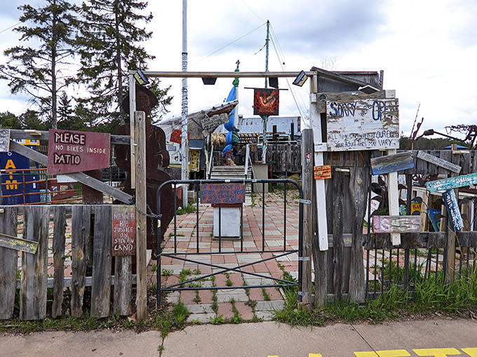 The entrance to Tom's Burned Down Caf&eacute; looks like what would happen if a shipwreck married a yard sale &ndash; and somehow, it works perfectly.