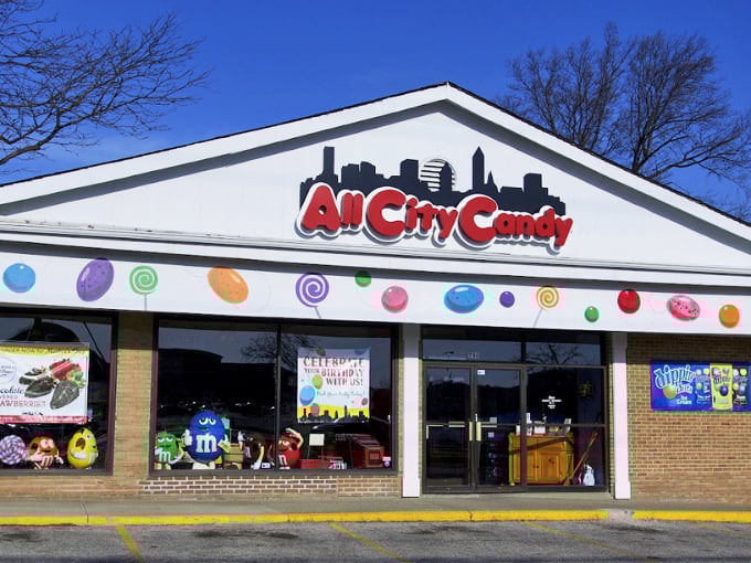 The All City Candy storefront beckons with colorful lollipop decorations and a skyline logo &ndash; Cleveland's very own sugar embassy inviting sweet-toothed diplomats of all ages.