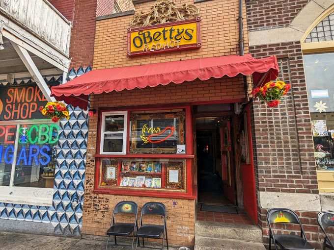 The bright yellow O'Betty's sign beckons like a hot dog lighthouse on Athens' brick-lined street. That red awning practically screams "delicious things happen here!"