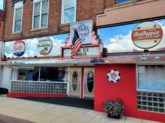 The classic red-and-chrome exterior of Mom's Diner screams "American nostalgia" louder than a Beach Boys greatest hits album playing at full volume.
