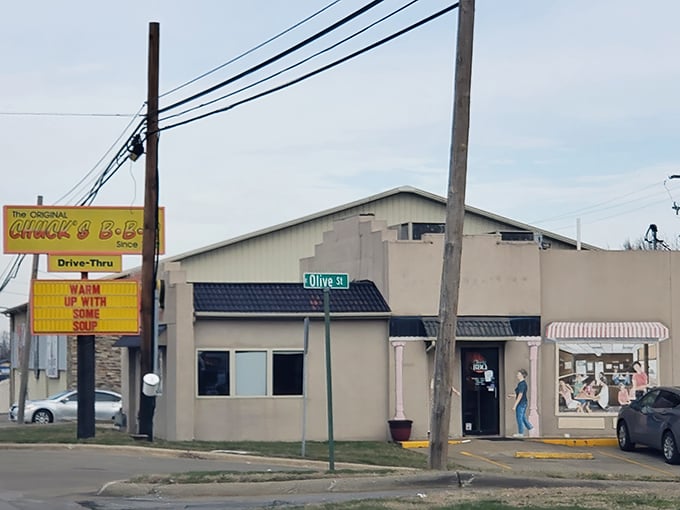 The iconic yellow sign of Chuck's BBQ stands as a beacon for barbecue lovers, promising smoky delights since 1952 in Herrin, Illinois.