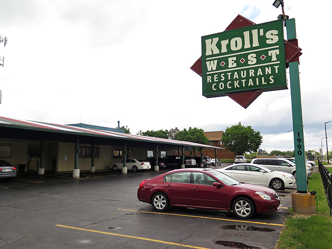 The iconic green and red Kroll's West sign stands proudly near Lambeau Field, a beacon for cheese curd pilgrims and hungry Packers fans alike.