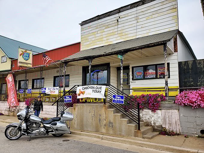 Small-town charm meets burger paradise at Top Dawg's exterior &ndash; where that "CHICKEN QUE TODAY" sign promises delicious things await inside.
