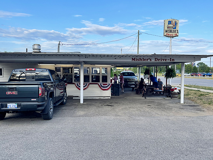 Classic Americana at its finest: Mishler's Drive-In stands proudly against the Michigan sky, a time capsule of flavor waiting to be discovered.