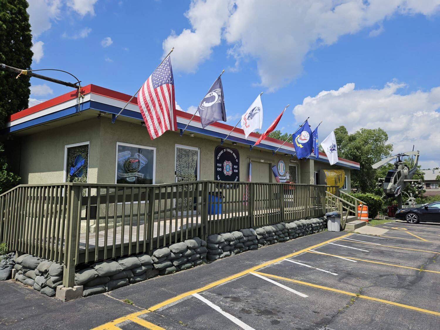 The DMZ Bunker's exterior stands at attention with patriotic flags and military-inspired design &ndash; your first clue this isn't your average Wisconsin eatery.