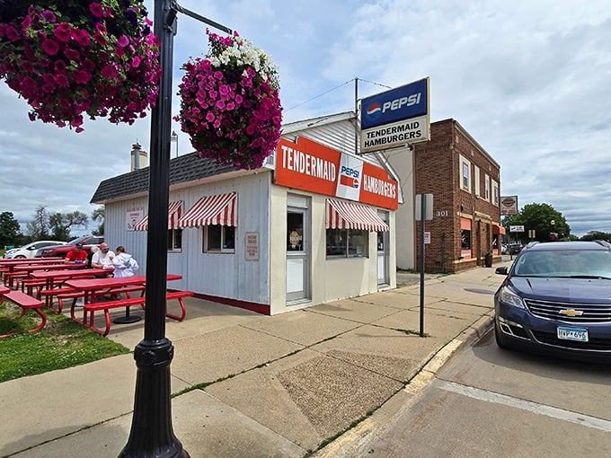 A slice of Americana awaits at Tendermaid, where vibrant hanging flowers frame this unassuming burger haven that's been stopping time since 1938.
