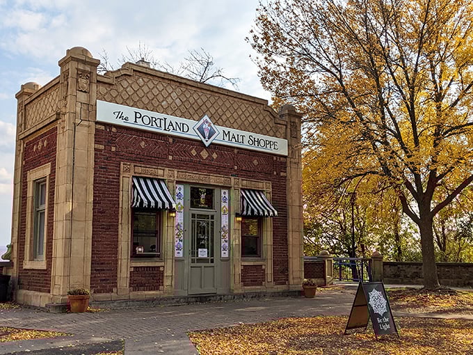 Autumn's golden touch frames the Portland Malt Shoppe perfectly &ndash; brick, awnings, and falling leaves creating a Norman Rockwell scene come to life.