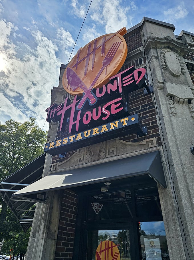 The iconic Haunted House Restaurant sign beckons brave diners with its knife and fork tally marks &ndash; dinner with a side of delightful dread!