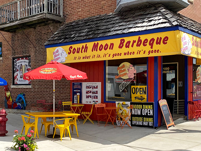 The vibrant yellow storefront of South Moon Barbeque stands like a beacon of smoky promise, its cheeky motto practically daring you to arrive early.