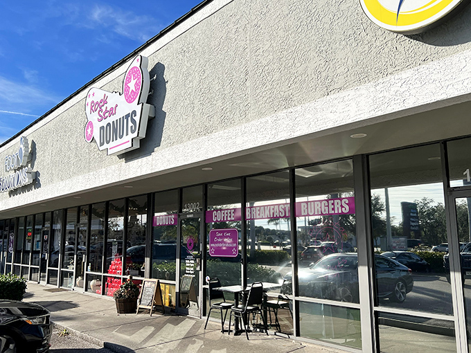 Exterior: The pink-signed sanctuary beckons from the strip mall, promising doughnut adventures that'll make your morning commute worthwhile.