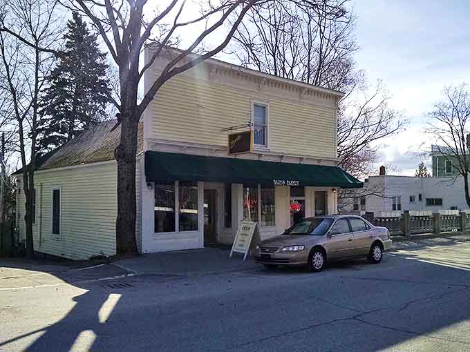 A humble yellow clapboard building with a green awning stands quietly on Northport's main street, hiding sweet treasures within its unassuming walls.