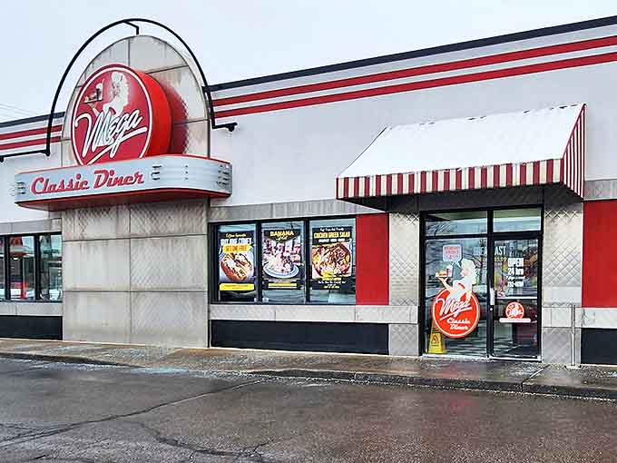 The red and white fa&ccedil;ade of Mega Classic Diner glows like a beacon of comfort food, promising nostalgic delights within its chrome-trimmed walls.