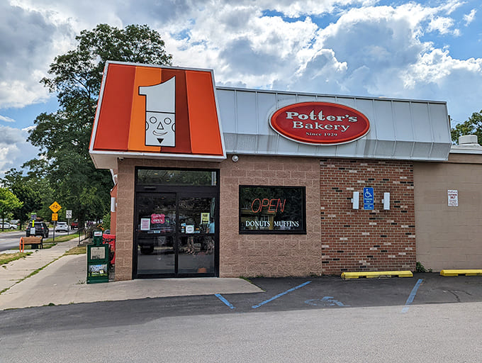 That cheerful chef logo has been welcoming donut lovers since way back when, standing guard over a brick building that's seen generations of sugar-seekers pull into this parking lot with hope in their hearts.