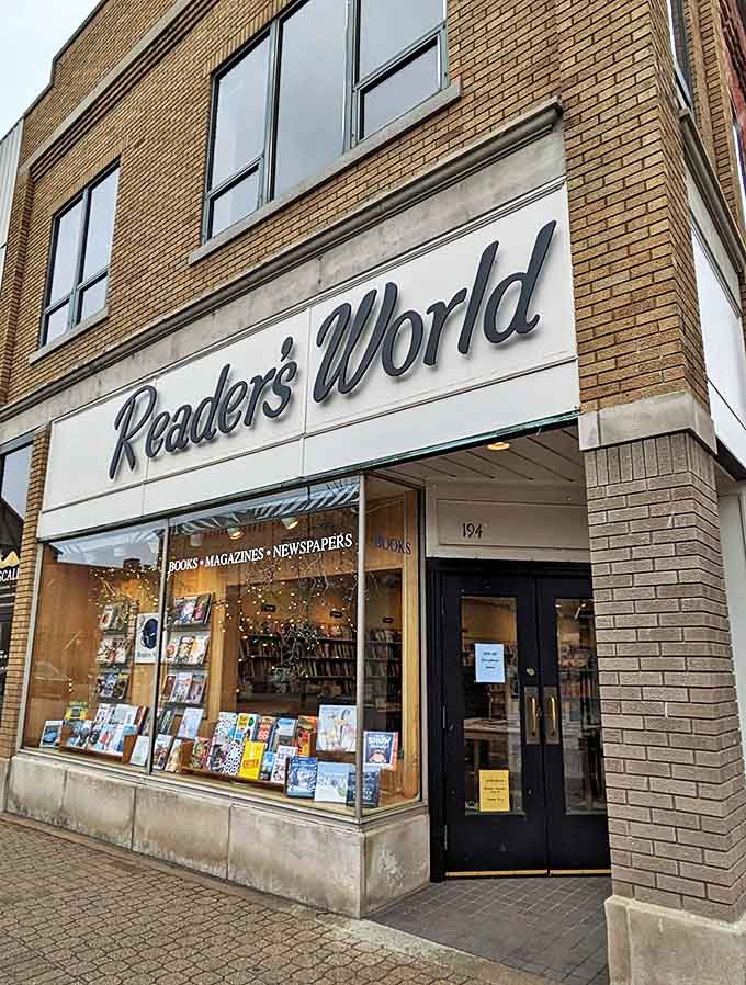 The iconic brick facade of Readers World beckons bibliophiles with its classic signage and inviting window displays, a literary lighthouse on Holland's River Avenue.