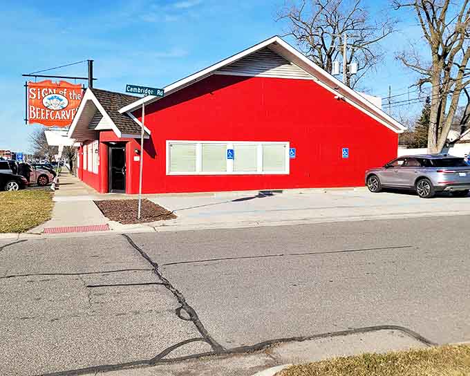 The bright red exterior of Sign of the Beefcarver stands out like a beacon of comfort food promise on Cambridge Road in Royal Oak.