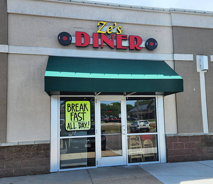Ze's Diner exterior beckons with its vibrant signage and promise of "BREAKFAST ALL DAY!" – a siren call to hungry travelers and locals alike.