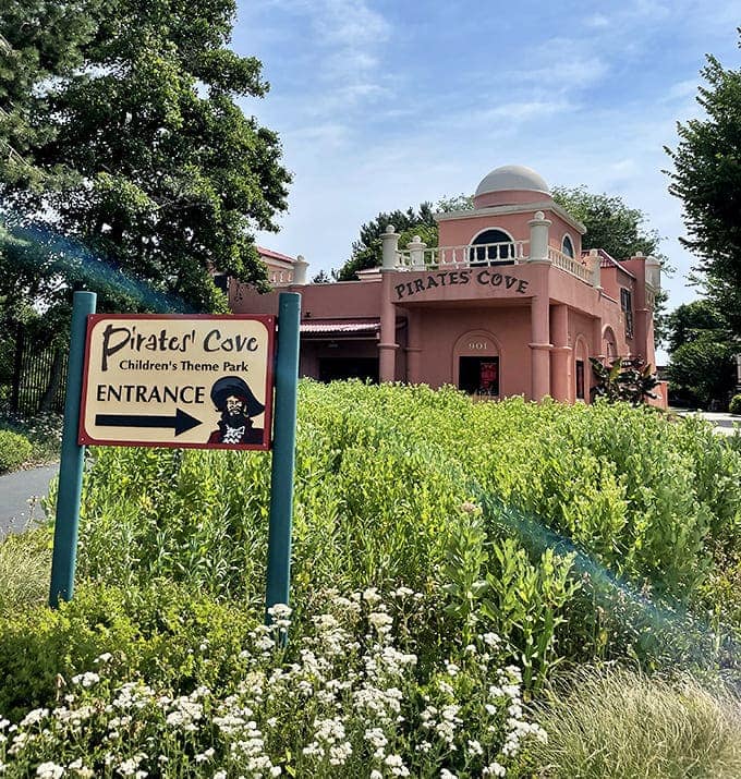 The charming pink stucco entrance to Pirates' Cove welcomes young buccaneers with the promise of adventure hiding just beyond those doors.