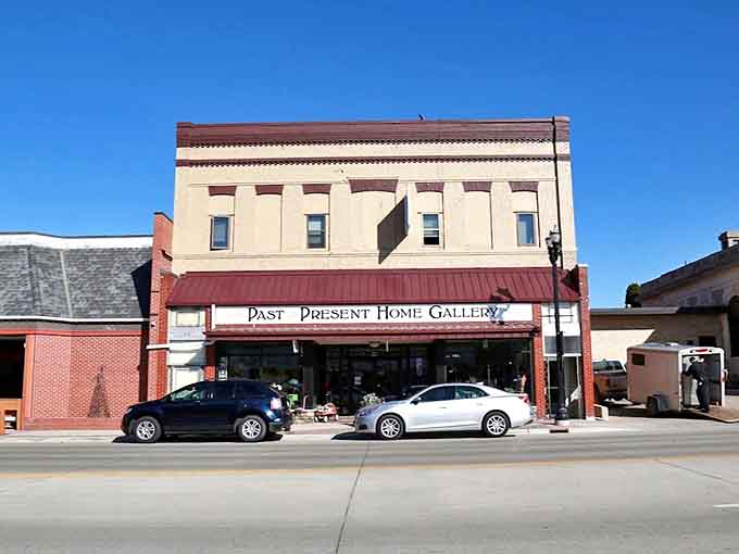 The stately brick facade of Past & Present Home Gallery stands proudly on Alexandria's main street, promising treasures within its historic walls.