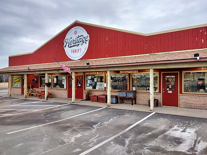 The bright red exterior of Heritage Thrift stands like a beacon for treasure hunters, promising adventures in secondhand shopping behind its welcoming doors.