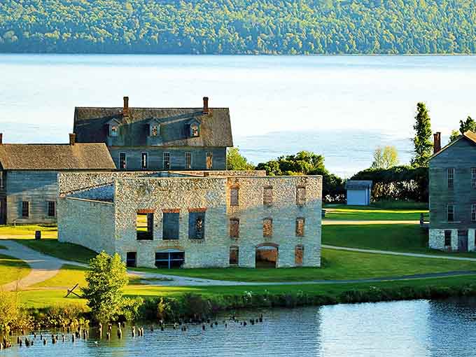 Stone buildings stand sentinel against the shimmering backdrop of Big Bay de Noc, time-travelers from Michigan's industrial heyday.