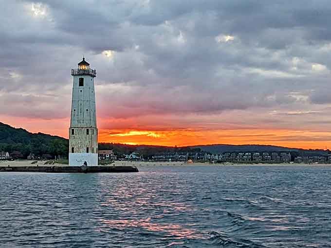Frankfort North Pier Lighthouse: Sunset paints the sky in fiery oranges behind this stalwart sentinel, standing watch as it has for generations.