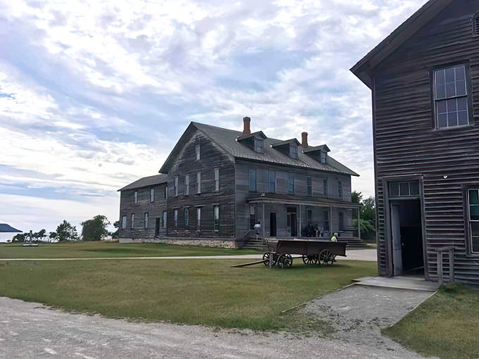 Weathered wooden giants stand sentinel against Michigan skies, whispering tales of industrial glory days long past.