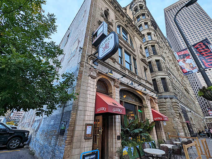 Exterior: Historic charm meets downtown vibrancy at Gluek's, where the limestone facade has welcomed hungry Minnesotans since 1902.