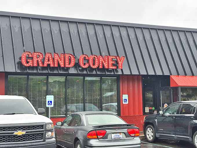 The iconic red "GRAND CONEY" sign glows like a beacon for hungry souls, promising comfort food salvation 24 hours a day.