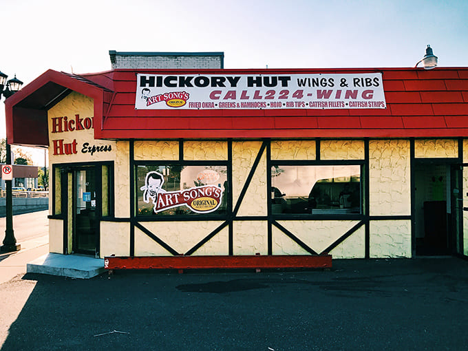 The iconic red-roofed Hickory Hut stands like a barbecue beacon in St. Paul, promising smoky delights without an ounce of pretension.