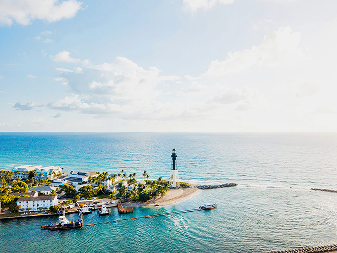 Like a sentinel from another era, Hillsboro Inlet Lighthouse stands proudly against the Florida sky, guarding the meeting point of turquoise waters and golden shores.