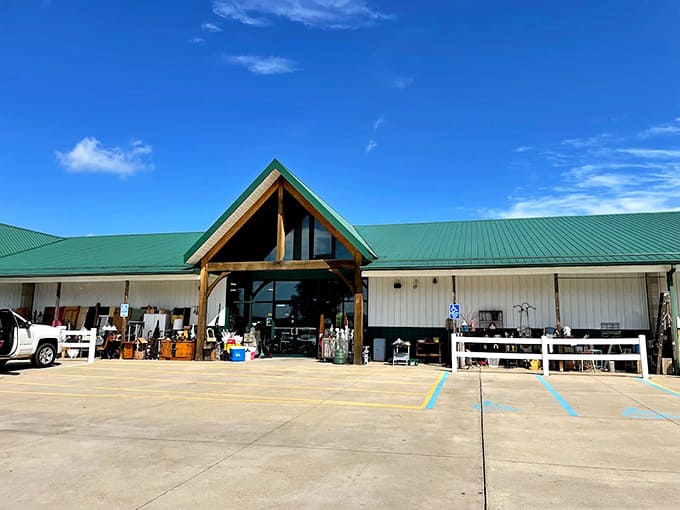 The impressive exterior of Hog Creek Antique Mall welcomes visitors with its distinctive green roof and spacious parking, promising 23,000 square feet of vintage treasures waiting inside.