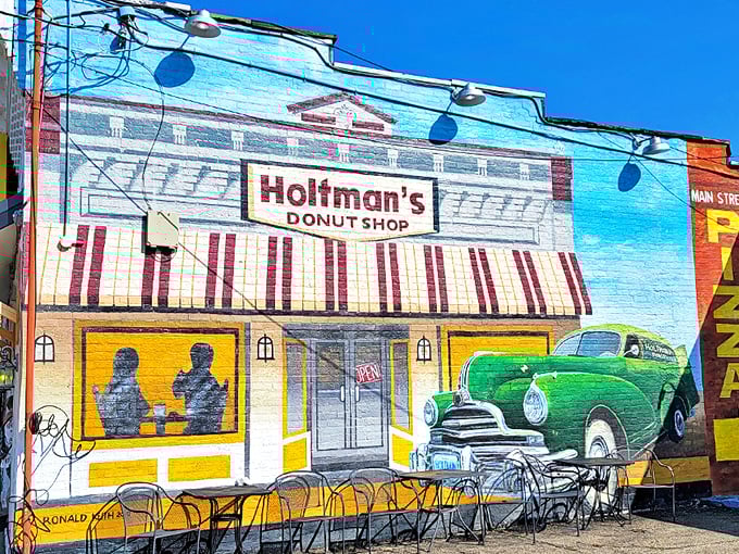 The vibrant mural of Holtman's Donut Shop captures the nostalgic charm that awaits inside &ndash; a colorful promise of sweet memories to come.